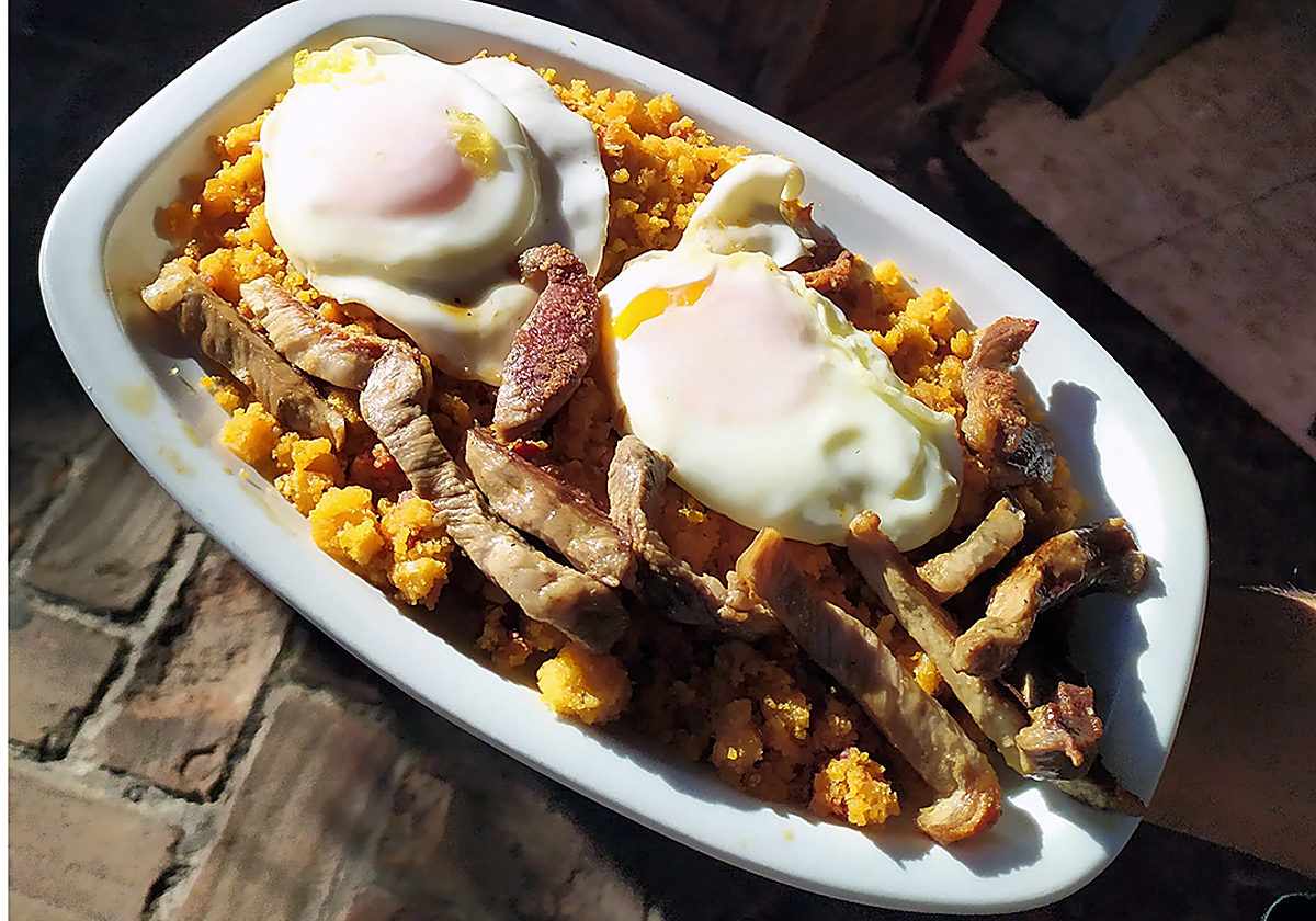 Migas, arroces y cuchareo del bueno: la bodega del Aljarafe que ...